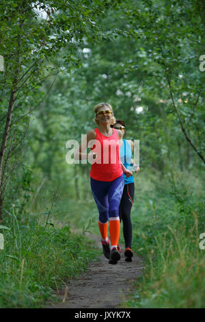 Photo of cute running girl in summer Stock Photo - Alamy