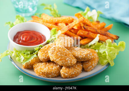 vegan soy nuggets and sweet potato fries healthy meal Stock Photo - Alamy