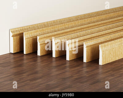 Baseboards with various profiles standing on hardwood surface. 3D ...