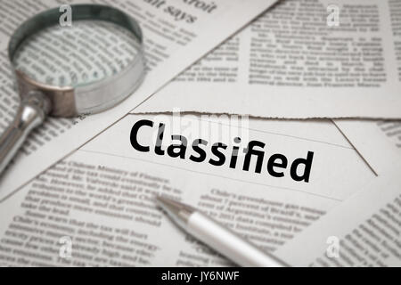 classified headline on newspaper background Stock Photo - Alamy