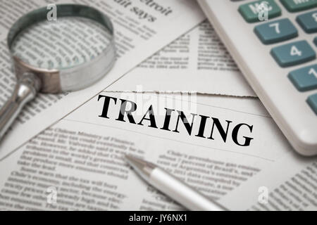 training headline on newspaper background Stock Photo - Alamy