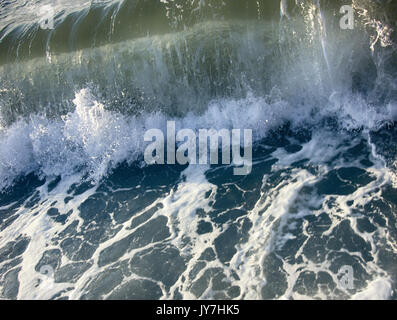 raging sea water at beach. forces of nature in performance of waves of ...