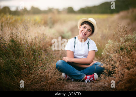 Happy child in summer wheat field Stock Photo - Alamy