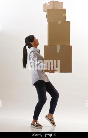 asian woman carrying stack of boxes Stock Photo - Alamy