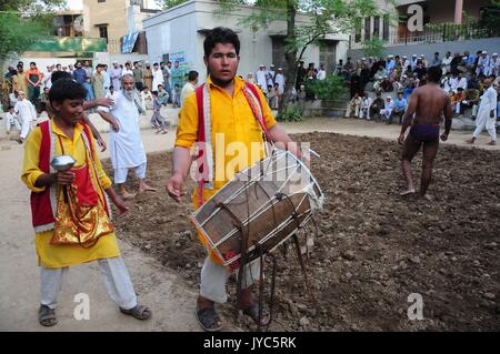 Wrestlers in action during traditional wrestling Malh competition held ...