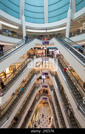 People use the escalators in the Suria KLCC shopping mall in Kuala Lumpur Stock Photo - Alamy