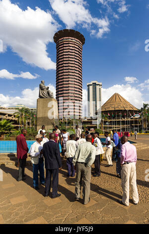 People standing by Jomo Kenyatta statue with Kenyatta International ...