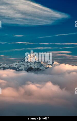 Snowy mountains emerging from the clouds Stock Photo - Alamy