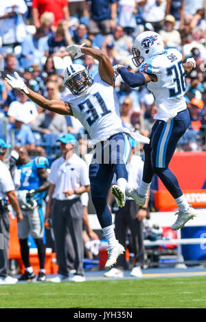 The Tennessee Titans celebrate a turnover in the second quarter against ...