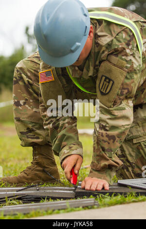 U.S. Army Sgt. Kenneth Killingbeck, 486th Engineering Company, prepares ...