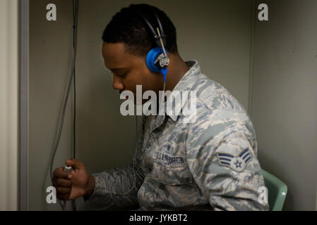 Senior Airman Alphonso Carter, 374th Public Health technician, is ...