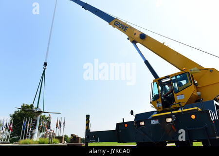Air Force maintenance personnel replace the door hinge on an A-10 ...