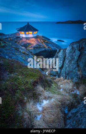 Norwegian seascape, lighthouse on the island, rocky coast with dramatic ...