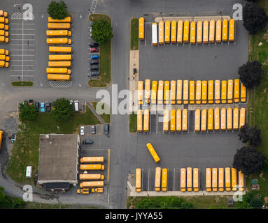 Public school buses lined up and parked in school bus parking lot Stock ...