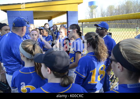 Softball coach discusses strategy with his team Stock Photo - Alamy