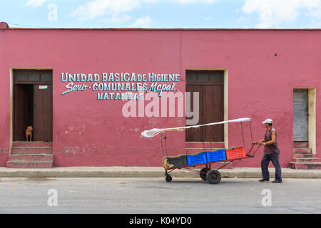 Cuban street scene, dogs look out at man with cart walking by, Hygiene ...