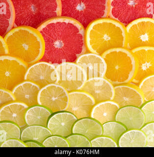 orange slices and lemon pattern on blue wooden background Stock Photo ...