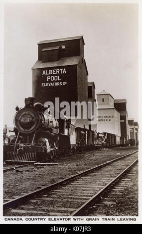 Grain elevators and loading train Nanton Alberta Canada Stock Photo - Alamy