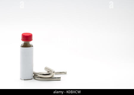 Thai herbal powder snuff in classic bottle with red cap and two snuff ...