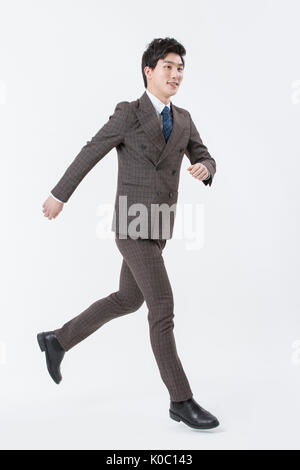 Confident businessmen running Stock Photo - Alamy
