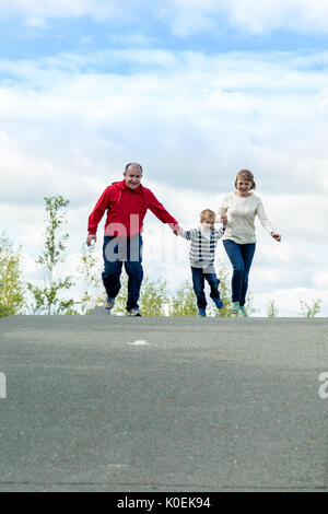 Dad, mom and son compete in the race Stock Photo - Alamy