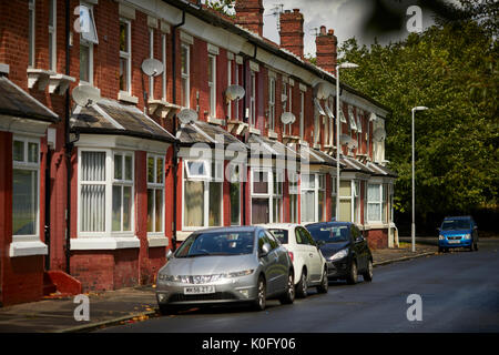 A street of terraced houses in the Moss Side area of Manchester ...