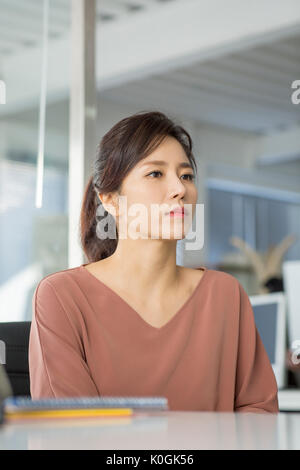Waist up portrait of female director giving instructions to cast and ...