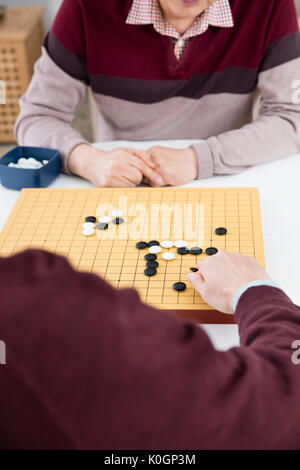 Korean men playing a strategy board game called Janggi changgi or ...