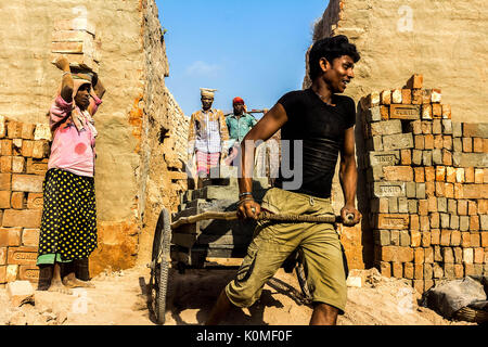 Indian man carrying bricks on his head Jahukel brick factory Nepal ...