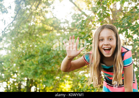Friendly smiling girl waving hand to say hi, greeting someone Stock ...