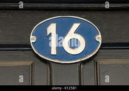 White number 16 wooden front door with grey surround in shade of ...