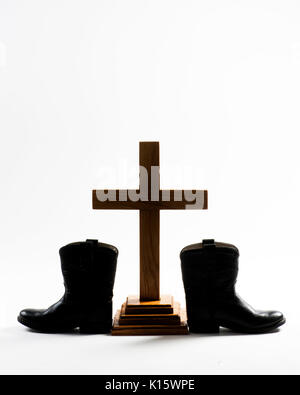 Cowboy Church with cowboy boots and Holy Cross Stock Photo - Alamy