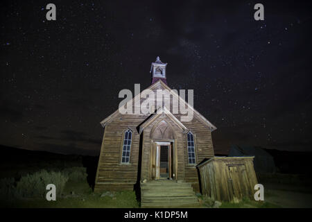 Methodist church illuminated against night skies in Bodie State Historic Park Stock Photo - Alamy