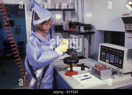 A CDC scientist conducts laboratory research in the Biosafety Level 4 ...