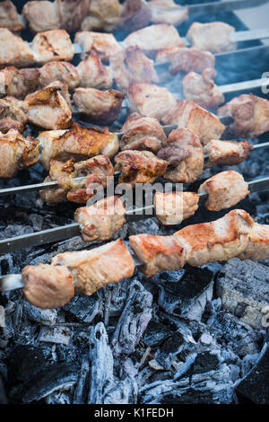 Georgian mtsvadi, Shashlik preparation. Smoking shashlik on the grill ...