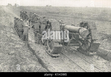British soldiers moving a big gun forward across a waterlogged battle ...