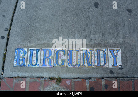Burgundy word lettering ceramic tile street sign Stock Photo - Alamy
