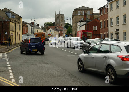 An ambulance car threading its way through traffic while attending to ...