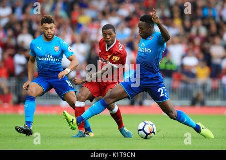 Liverpool's Georginio Wijnaldum (left) and Arsenal's Willian battle for ...