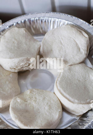 Raw biscuits prepared for cooking in a pan Stock Photo - Alamy