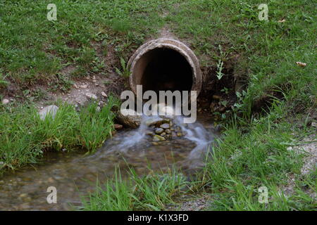 Small Waterfall from Drain Pipe at Kiwanis Park in black and white ...