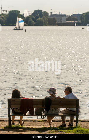 Sitting at the lakeside in Hamburg, Germany Stock Photo - Alamy