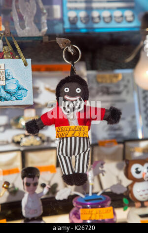 A gollywog golliwog golly wog minstrel toy doll figurine on a white ...