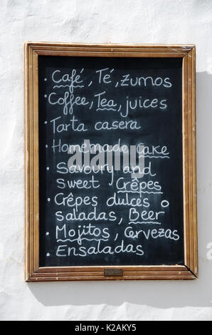 Menu in Spanish and English on wall at El Patio restaurant in Lake ...