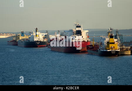 Products Tanker discharging at the Oil Terminal with blue hull and red ...