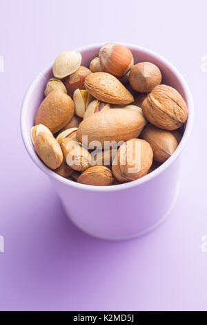Unpeeled cashew nuts heap in the bowl Stock Photo - Alamy
