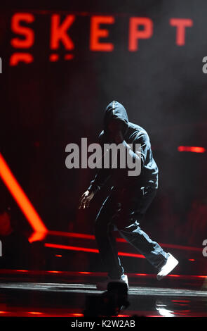 Skepta performing on stage at the Brit Awards at the O2 Arena, London ...
