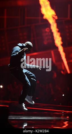 Skepta performing on stage at the Brit Awards at the O2 Arena, London ...