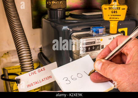 Inside a gas meter cupboard with the yellow key on top of the sealed ...