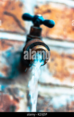outside tap running water, wasting water, tilities, drought, water ...